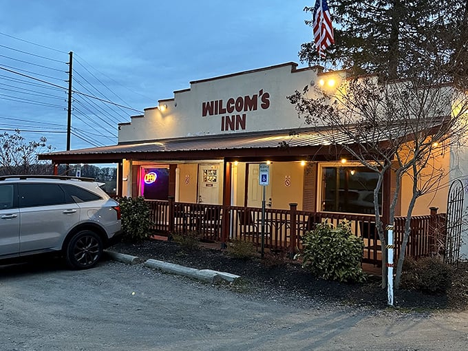 Twilight transforms Wilcom's Inn into a cozy oasis for meat lovers. That warm glow promises comfort food that hits all the right notes.