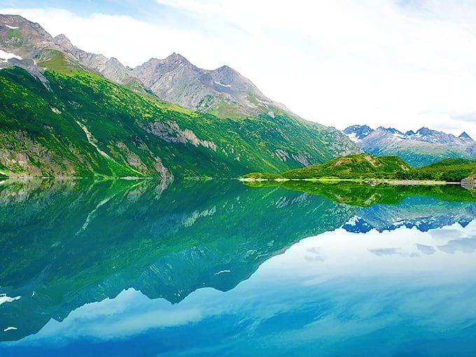 Mirror, mirror on the lake&mdash;who's the fairest view of all? This glass-like reflection makes double the mountain for your memory card.