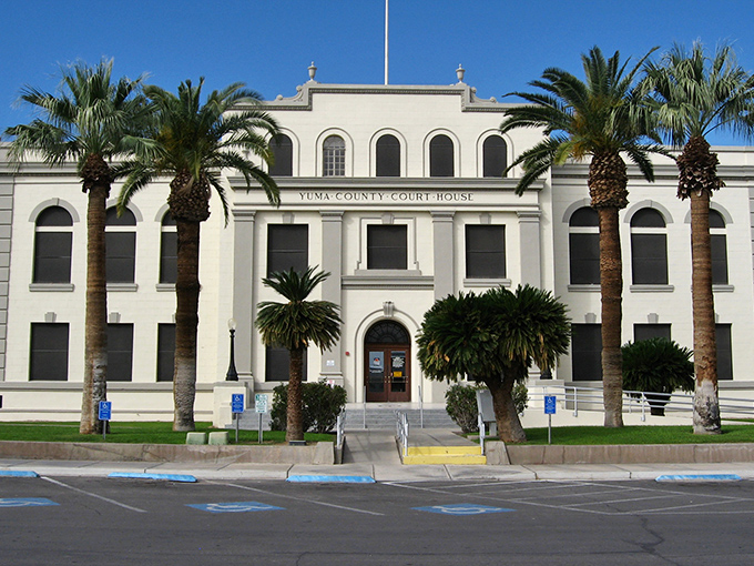 The stately Yuma County Courthouse surrounded by palm trees &ndash; desert elegance that would make Frank Lloyd Wright nod in approval.