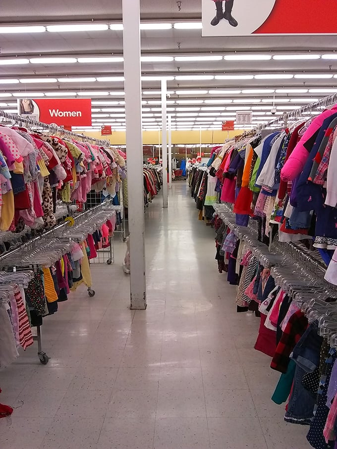 Rows upon rows of women's clothing stretch toward the horizon. Each garment holds a story, waiting for its next chapter to begin. 