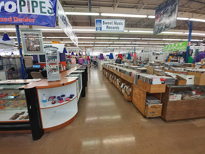 Sweet Music Records beckons vinyl enthusiasts while neighboring vendors display their wares in this indoor labyrinth of nostalgia.