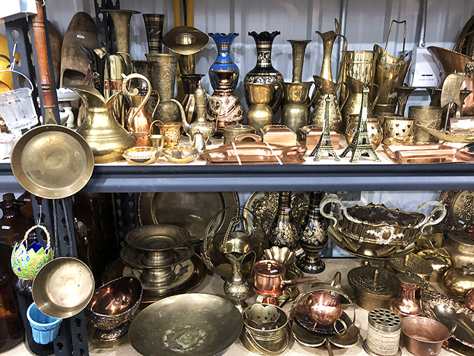 Brass and copper treasures gleam like a metallic sunset. One person's outdated decor is another's statement piece waiting to happen.