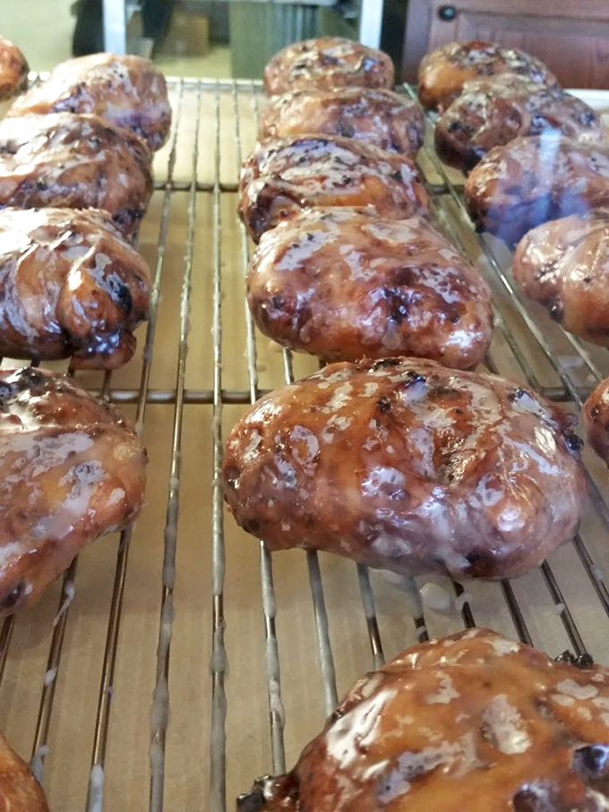 The legendary apple fritters in all their glazed glory. These aren't just pastries&mdash;they're edible works of art that could make a carb-counter weep with joy.
