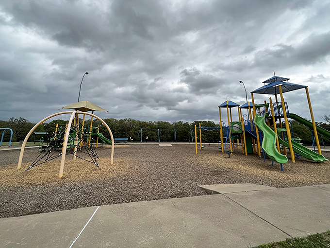 Nothing says "childhood memories in the making" quite like Ardmore Regional Park's playground equipment waiting under dramatic Oklahoma skies.