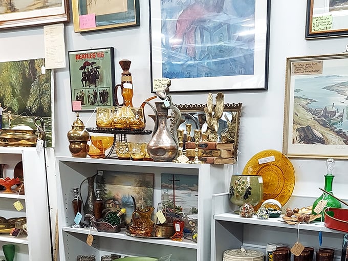 Beatles memorabilia alongside amber glassware? This booth is like a time capsule from the 1960s that someone decorated with liquid sunshine. 