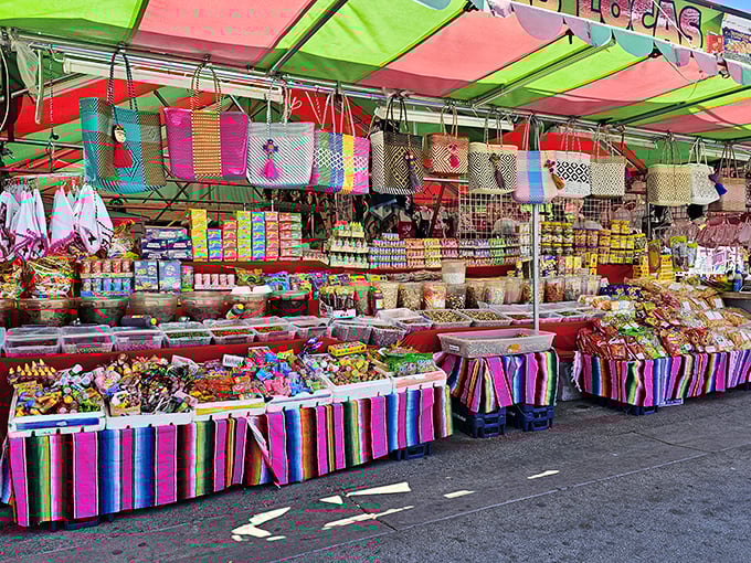 Woven bags and colorful totes hang overhead like a fiesta celebrating practical fashion meeting genuine craftsmanship.