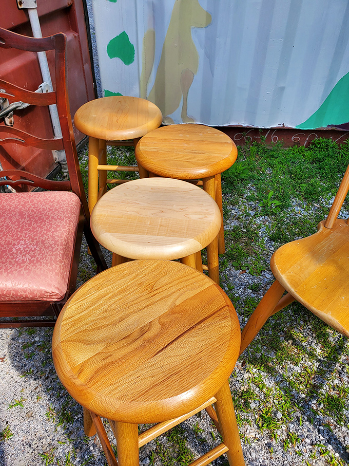 Bar stools lined up like eager contestants on a game show, each one ready to become the perfect perch in someone's kitchen.