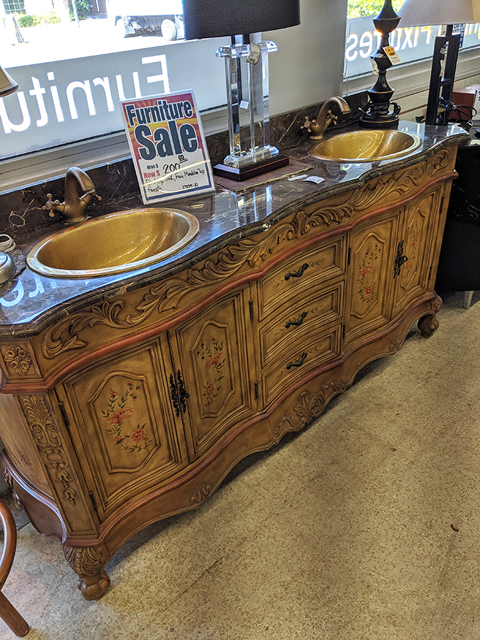 This ornate bathroom vanity with gold sinks isn't just furniture – it's a conversation piece that whispers, "Yes, I live fabulously."