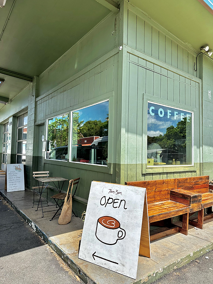 Nothing says "island time" quite like a rustic coffee shop with wooden benches and a hand-painted sign—caffeine paradise found!
