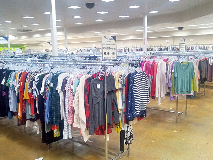 The women's section blooms with colors arranged like a fashionista's rainbow, where yesterday's splurges become today's steals.