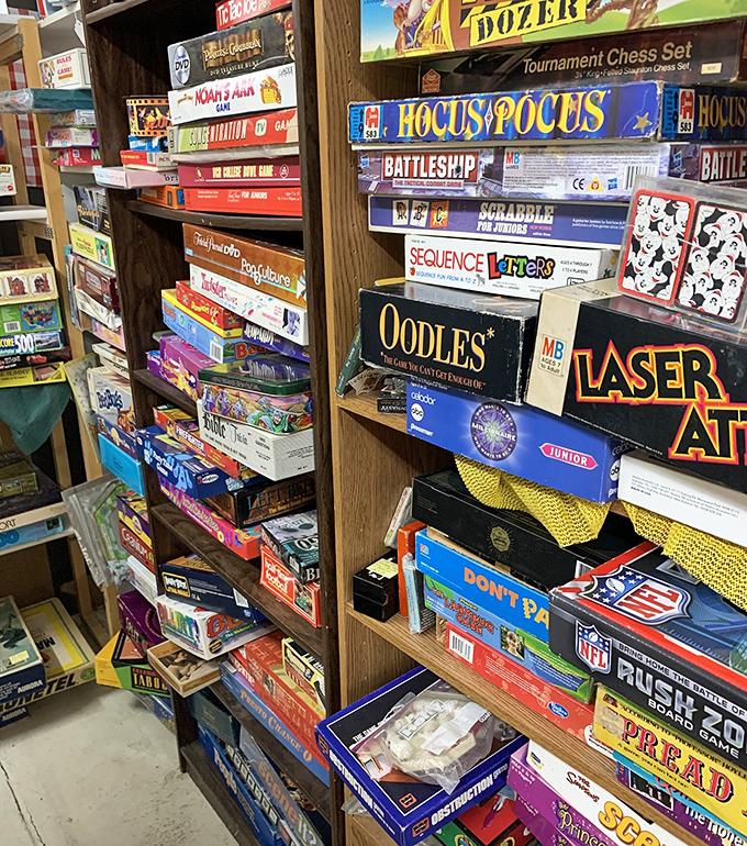 Remember when game night meant actual boards and pieces instead of screens? This wall of nostalgia proves Battleship is still better with real pegs.