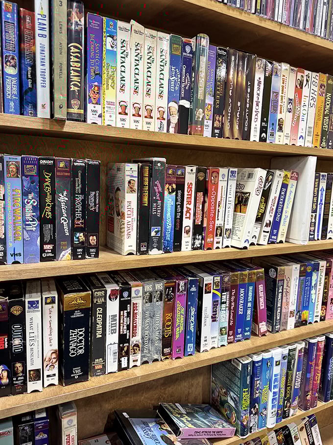 VHS tapes line the shelves like a time capsule from the days when "be kind, rewind" wasn't just a suggestion.