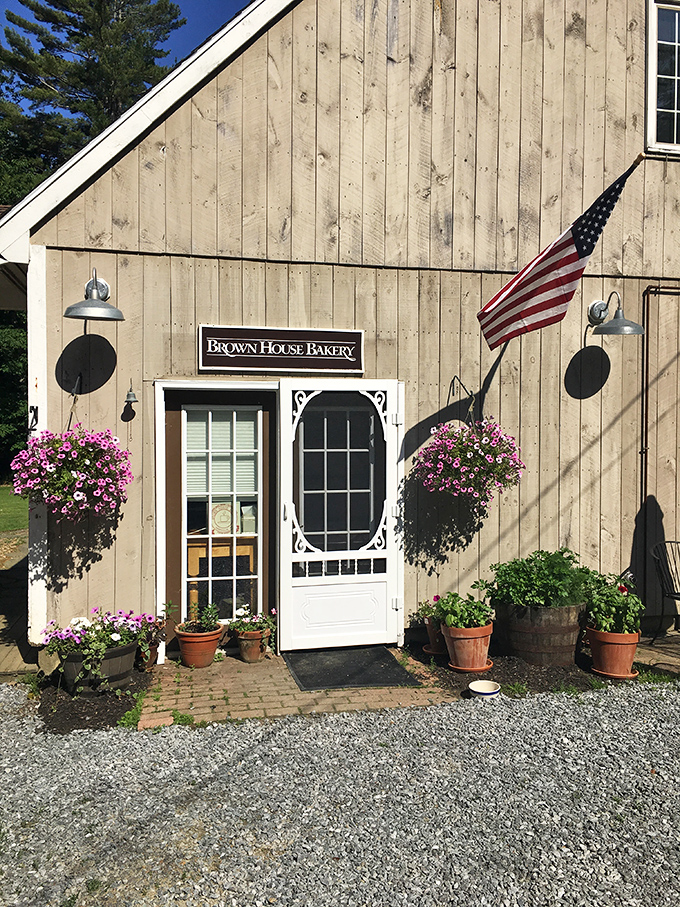 Brown House Bakery's weathered wooden charm and hanging flower baskets promise carbohydrate perfection that would make your doctor sigh and your taste buds applaud.