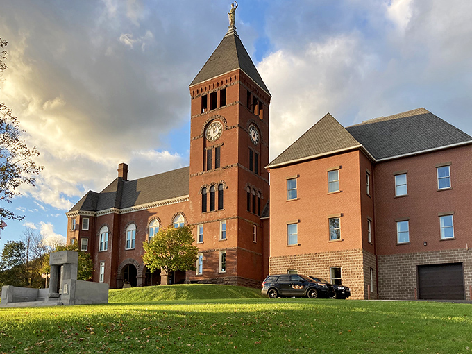 The Cameron County Courthouse stands as a stately sentinel, its brick tower catching the golden hour light like nature's own Instagram filter.