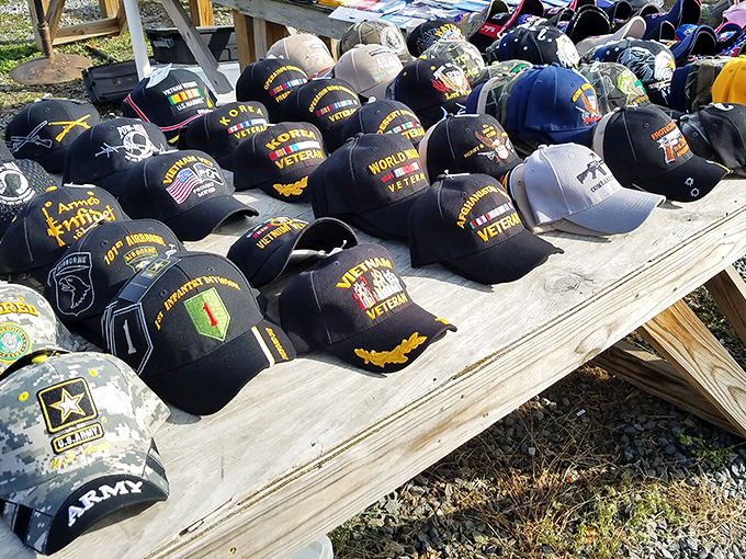 A battalion of veteran caps stands at attention, each one telling stories their owners have carried home from distant shores.