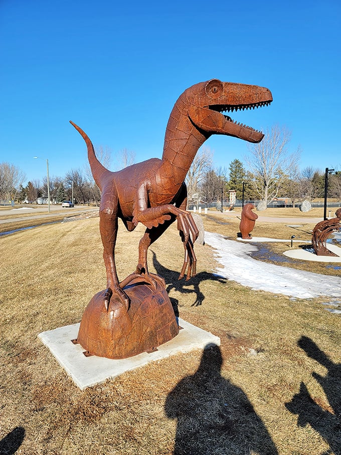 This rusty velociraptor might be the most exciting predator in town, unless you count Marge at the bingo hall when someone yells "Bingo" prematurely.