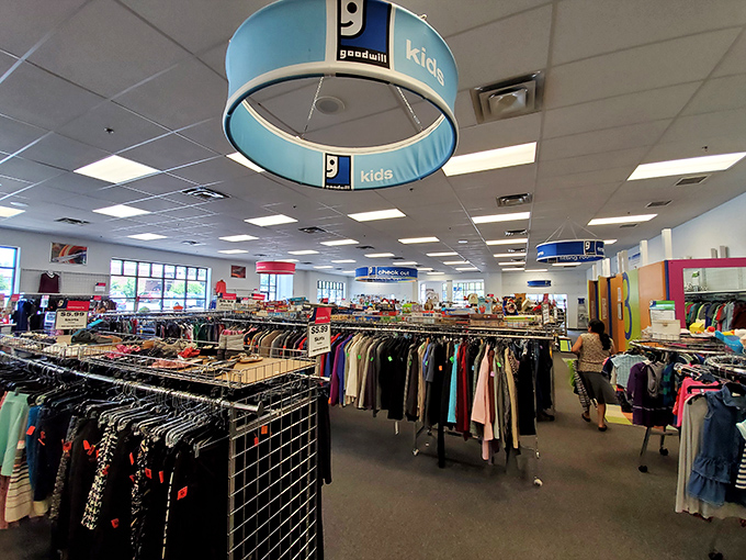 A treasure hunter's paradise where clothing racks stretch like an organized jungle of fashion possibilities waiting to be discovered.