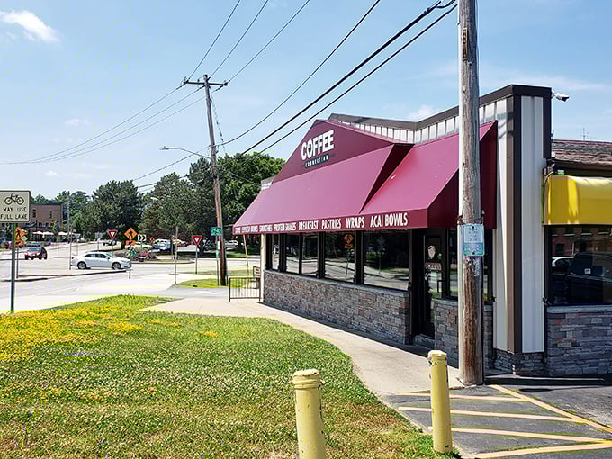The Coffee Connection's bright awning serves as a beacon for caffeine-seekers, promising both modern brews and old-fashioned conversation.