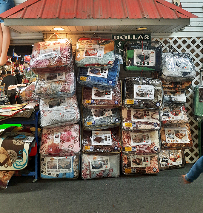 Stacks of comforter sets waiting patiently like fluffy clouds that decided retail was their true calling in life.