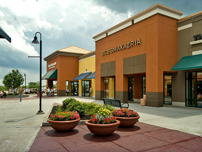 Those terra cotta planters overflow with flowers that somehow make spending money feel like a pastoral experience worth documenting.