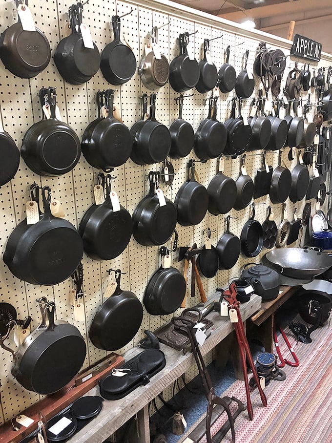 Cast iron heaven! Generations of family dinners and perfectly seared steaks hang in suspended animation, waiting for their next culinary adventure.