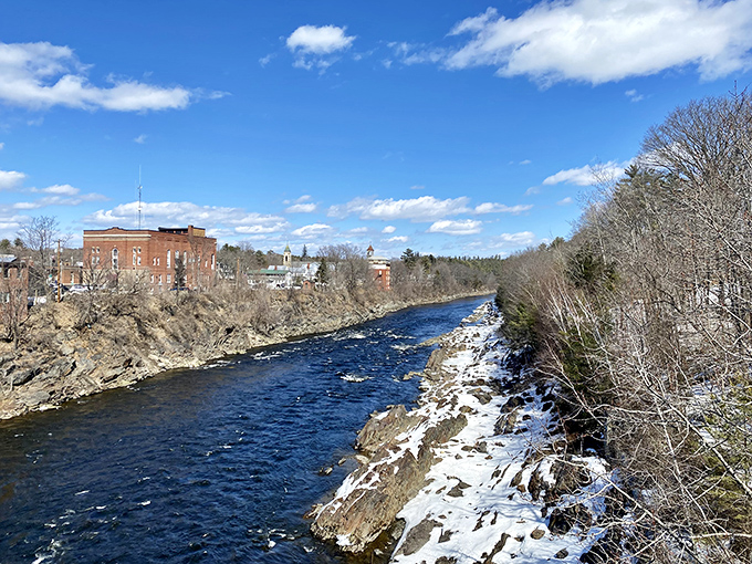 The Kennebec River carves its path through Skowhegan, a waterway that's been the town's lifeblood since long before anyone worried about retirement accounts.