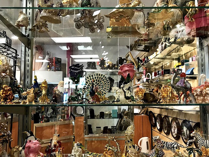 A treasure trove of miniature collectibles where one person's "clutter" is another's "curated collection." Peacocks and elephants living in glass harmony.