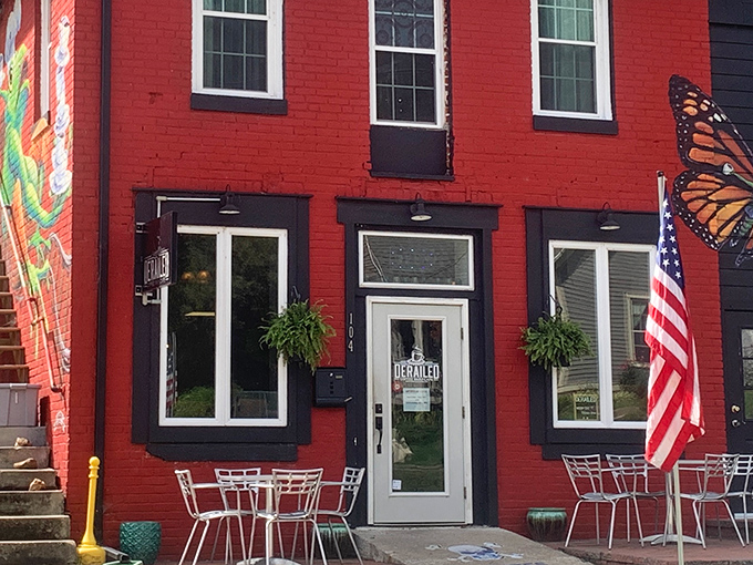 Derailed Commodity's vibrant red facade isn't just eye-catching—it's a promise of culinary adventures within. The outdoor seating practically begs you to linger over coffee.