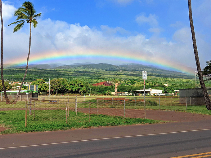 Nature's welcome committee! A perfect rainbow arches over Kaunakakai, as if Hawaii itself is saying "Aloha, you made it!"
