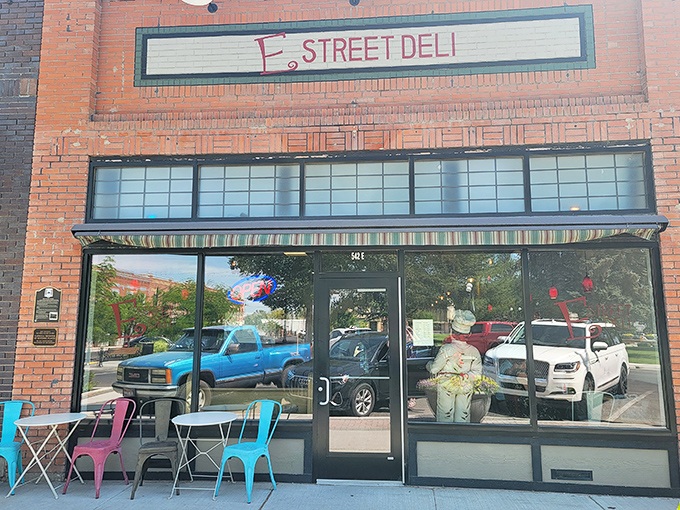 E Street Deli's colorful outdoor seating invites you to linger over lunch, proving that sometimes the best conversations happen at tiny tables.