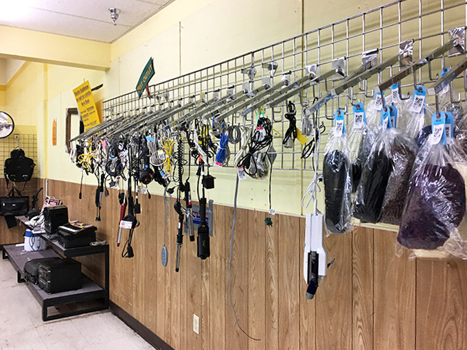 The accessories wall&mdash;where belts, ties, and gadgets hang like prizes in a carnival game that everyone can win.