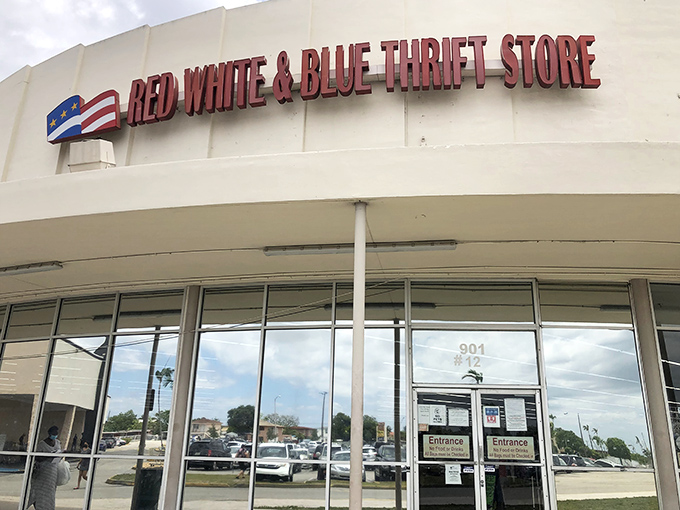 Like a pilgrim approaching a secondhand shrine, this shopper prepares to enter a world where yesterday's castoffs become tomorrow's treasures.