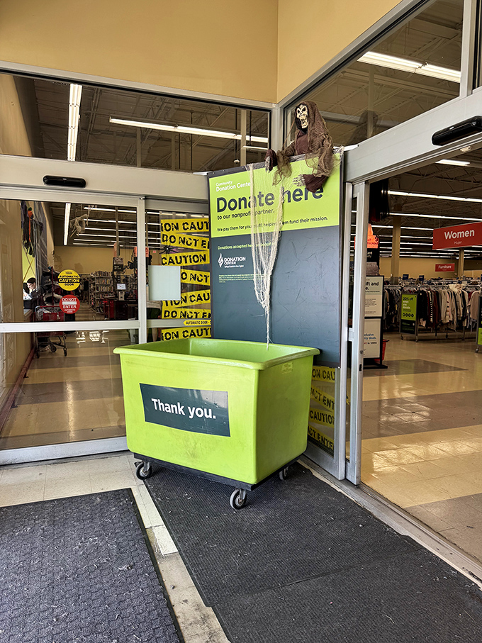 Halloween meets philanthropy at the donation entrance, where a spooky greeter silently thanks contributors for keeping the treasure cycle flowing.