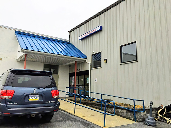 The blue-awninged entrance: your portal to possibility. Every great adventure needs a starting point, and this humble doorway has launched thousands of treasure hunts.