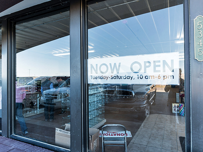 The "NOW OPEN" sign might as well read "TREASURE AWAITS"&mdash;these glass doors are portals to a parallel universe where everything costs less.