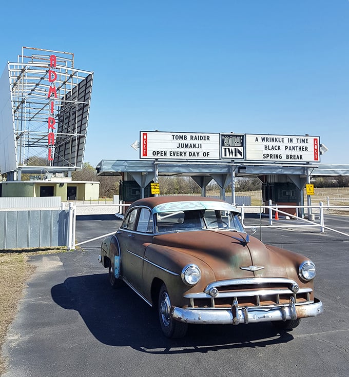 That classic car parked at the entrance isn't just transportation &ndash; it's a time machine to when drive-ins ruled American nightlife.