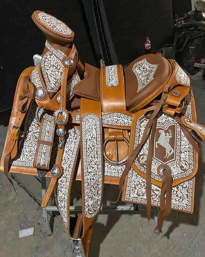 This ornate western saddle isn't just riding gear&mdash;it's wearable art, with intricate silver detailing that would make any cowboy swoon.