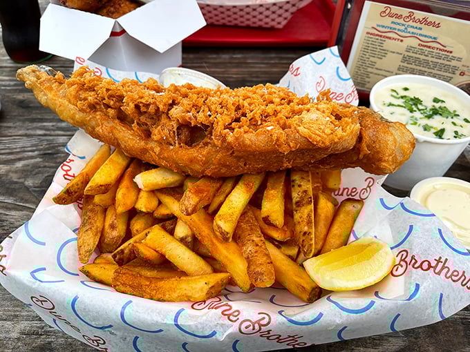 Golden perfection on a plate: crispy fish, mountain of fries, and enough deliciousness to make you forget your name. 
