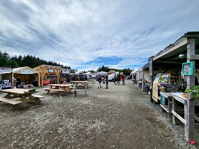 Nature's shopping mall. Wooden picnic tables and gravel pathways create the perfect backdrop for Homer's community gathering spot, where shopping is as much social event as errand.