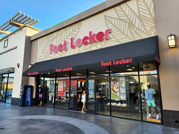 Foot Locker's black and white stripes beckon like a referee calling a time-out on full-price footwear. Your wallet's MVP moment awaits inside.