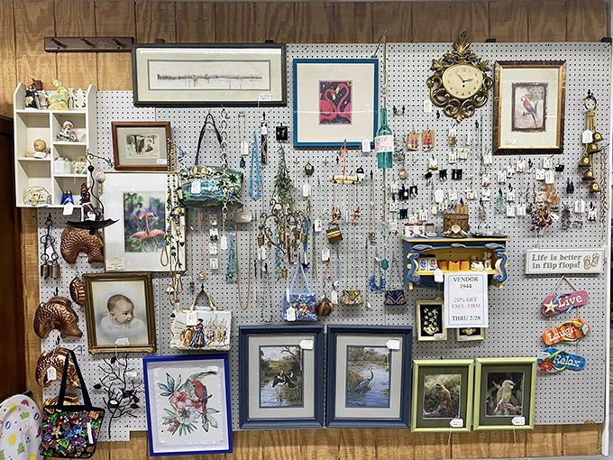 A pegboard gallery where memories hang in frames, proving one person's forgotten photograph is another's newfound treasure.