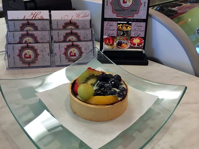 Behold the star attraction: a fruit tart that belongs in the Louvre. That glistening arrangement of berries and kiwi isn't just pretty&mdash;it's transformative.