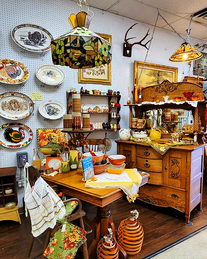 A perfectly staged vignette that whispers stories of Sunday dinners past. That oak sideboard has probably witnessed more family secrets than a therapist's couch.