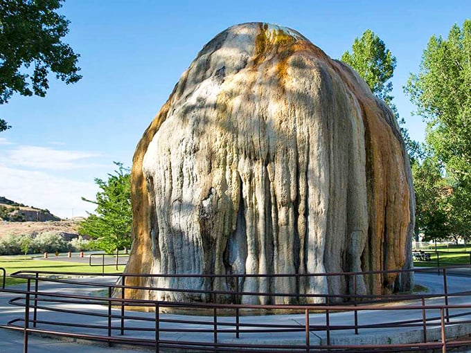 "The Tepee" hot spring formation stands like nature's sculpture, a mineral masterpiece that's been performing its slow-motion art show for centuries.