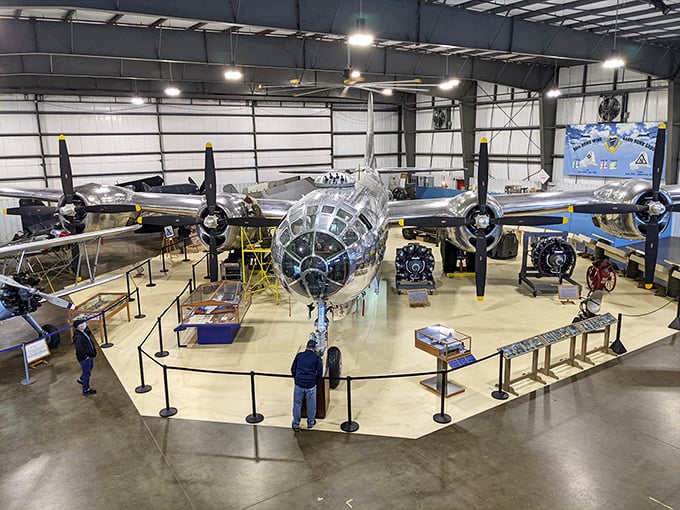 A gleaming B-29 Superfortress commands the hangar floor like a silver celebrity. This magnificent beast makes you realize airplanes aren't just machines &ndash; they're time machines.