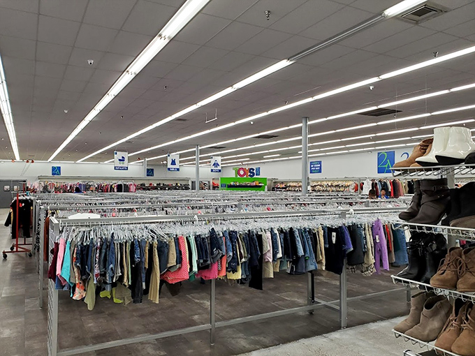 An ocean of clothing racks stretches to the horizon, organized with a precision that would make Marie Kondo nod in approval.