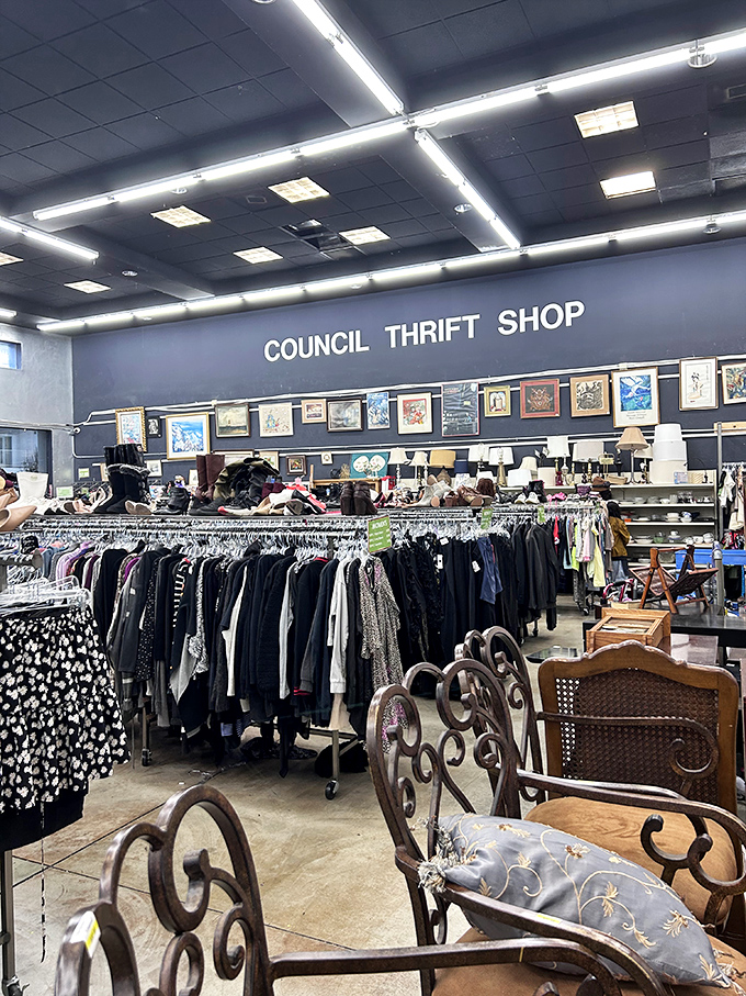 Elegant wrought iron chairs sit patiently among clothing racks, like royalty waiting to be discovered by the right shopper.