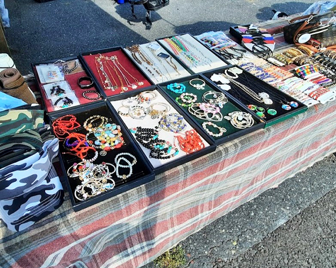 A crystal and jewelry vendor's display that makes you wonder if you've always needed an amethyst geode the size of a small dog.