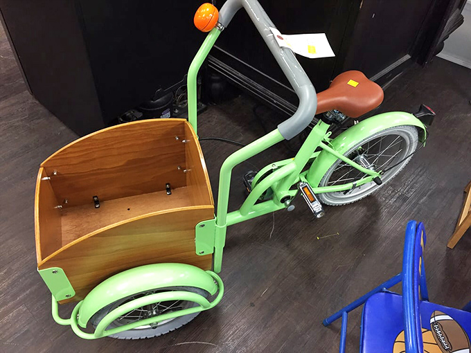 Someone's childhood dream awaits! This mint-green cargo bike could be hauling your little one's treasures by this afternoon.