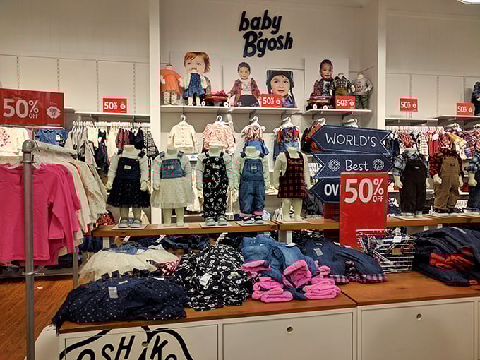 Baby B'gosh displays scream "50% OFF!" louder than toddlers scream for ice cream, making those adorable tiny outfits practically guilt-free purchases.
